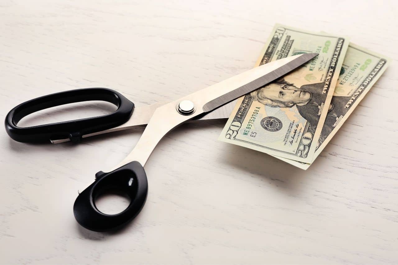 6 Ways to Drastically Reduce Your Spending - Budgeting Couple